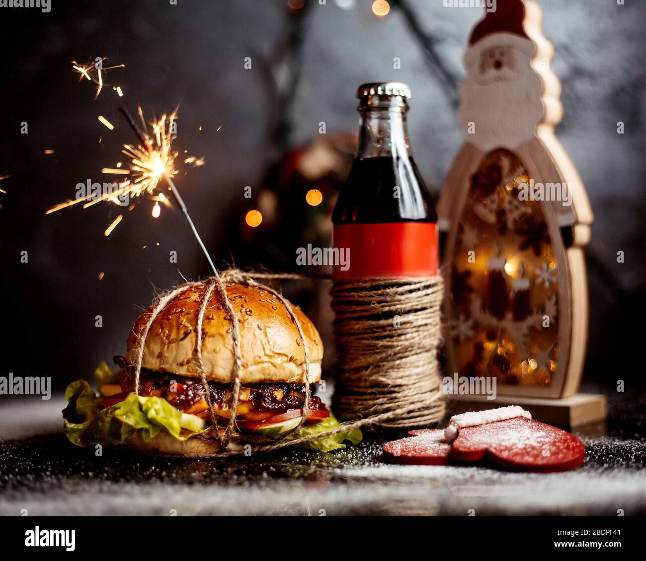 burger tied to bottle and firework Stock Photo - Alamy