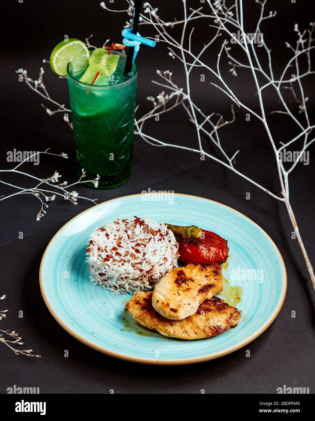 chicken cutlets with rice and beverage with lemon Stock Photo - Alamy