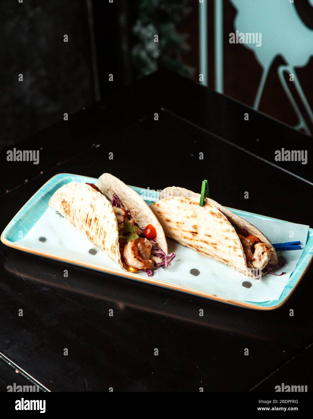 chicken slices and vegetables wrapped in flapjack Stock Photo - Alamy