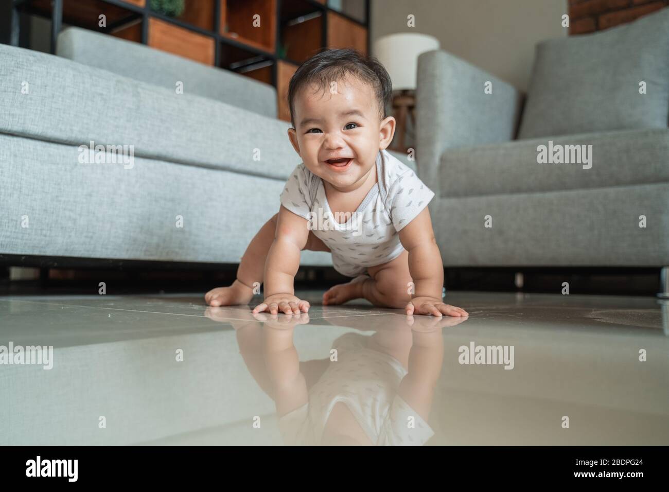 Baby infant crawling on floor hi-res stock photography and images - Alamy