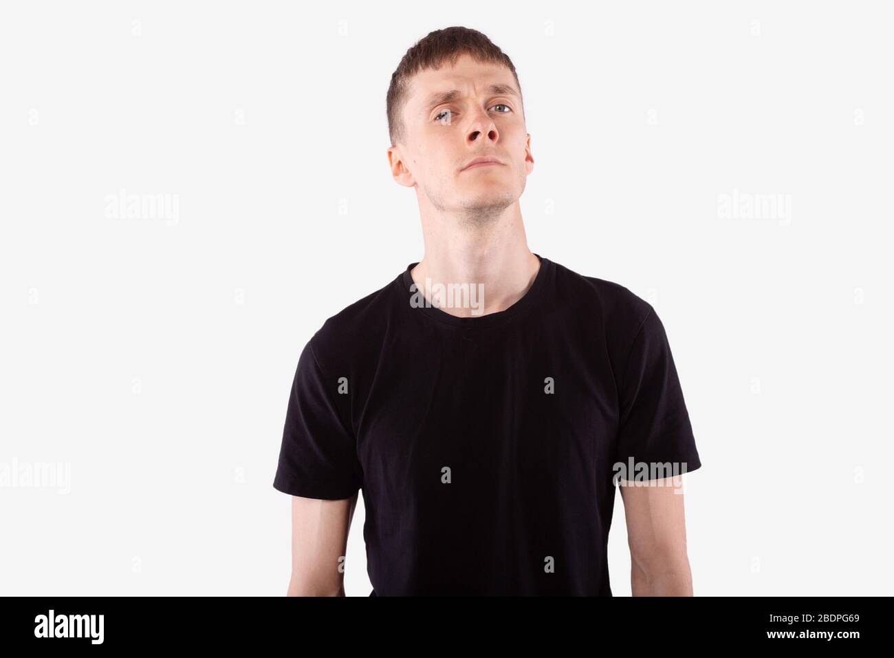 Young Caucasian Man Haughtily Looking At Camera Isolated On White