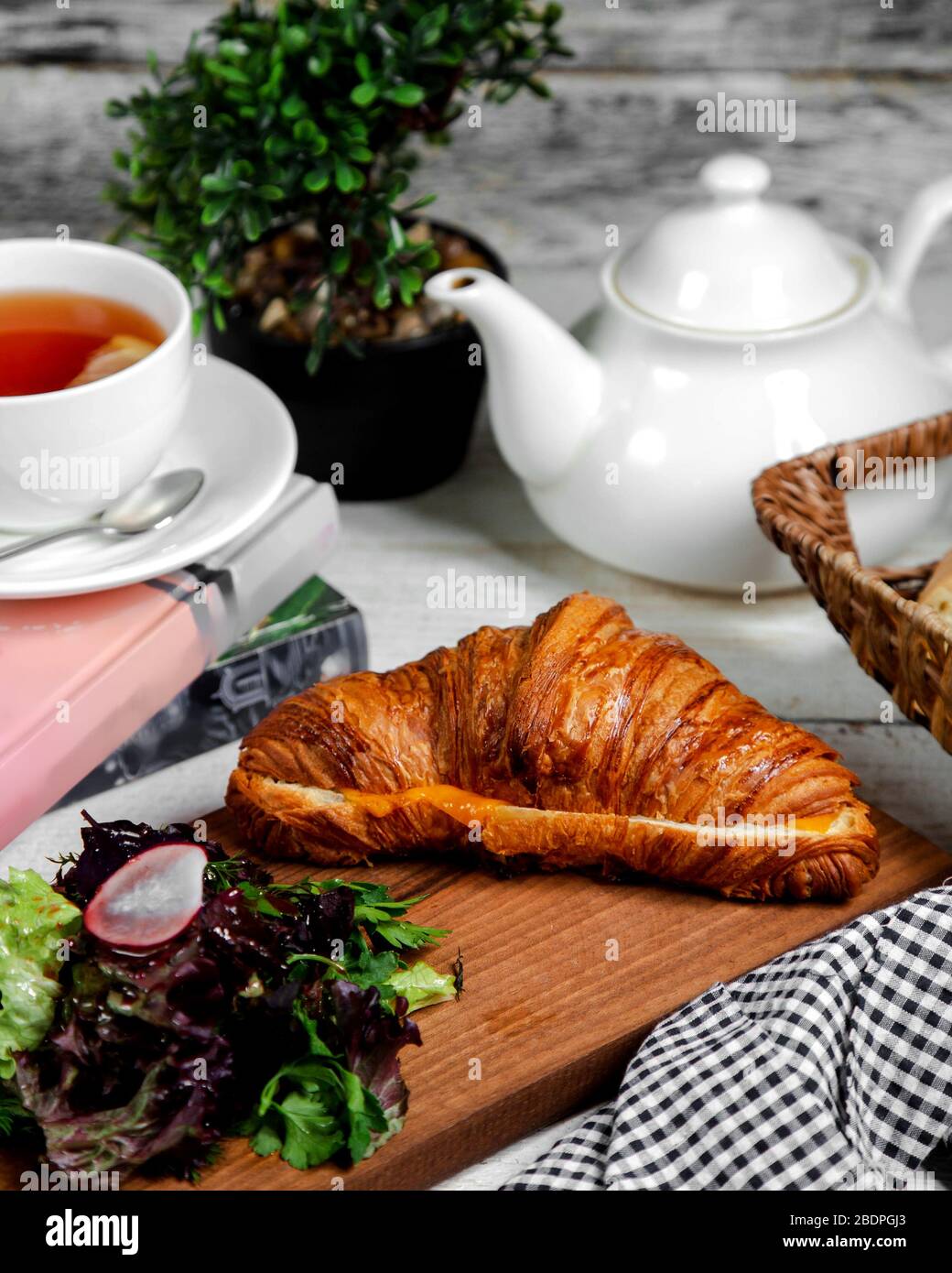 croissant and greenery with tea Stock Photo - Alamy