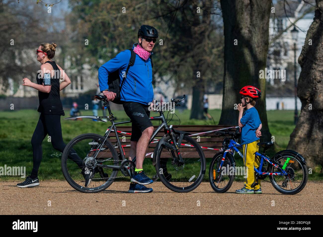 A father and son plan their route home - Clapham Common is pretty quiet ...