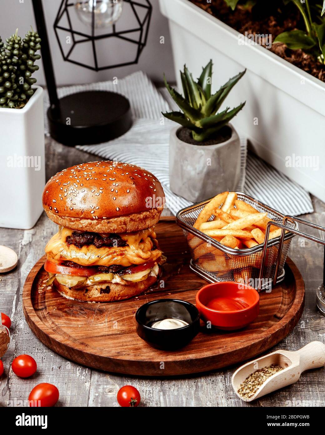 double burger with fries and ketchup Stock Photo - Alamy