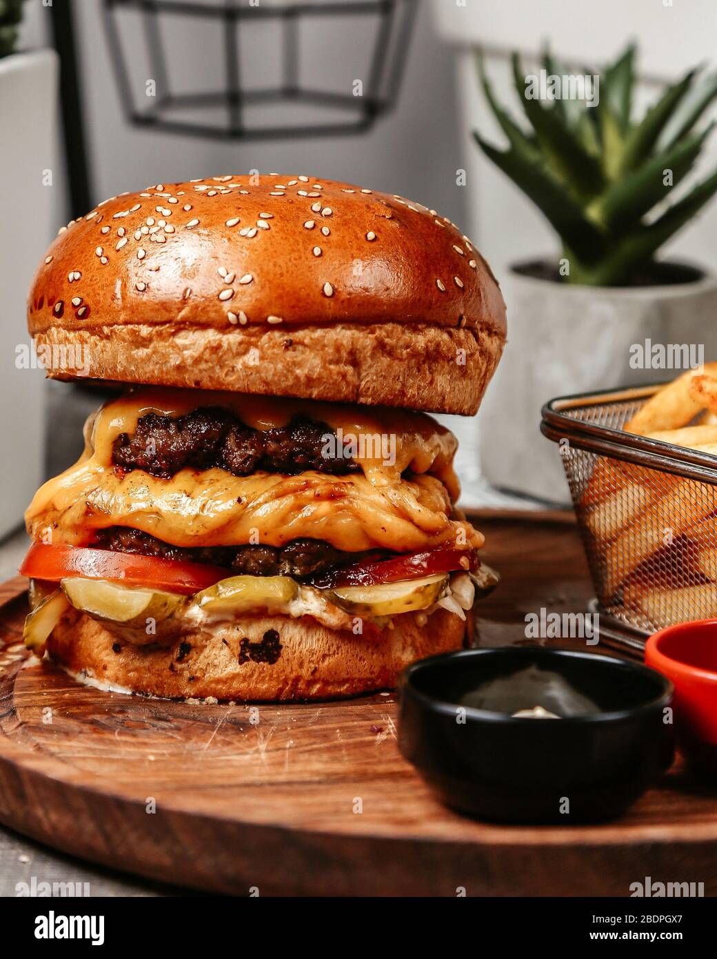 double cheeseburger with side fries Stock Photo - Alamy