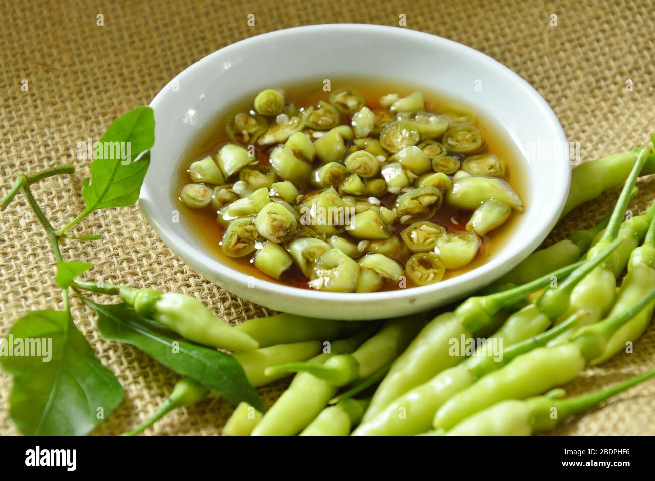 fresh green chili chop and mixed in fish sauce on cup Stock Photo - Alamy