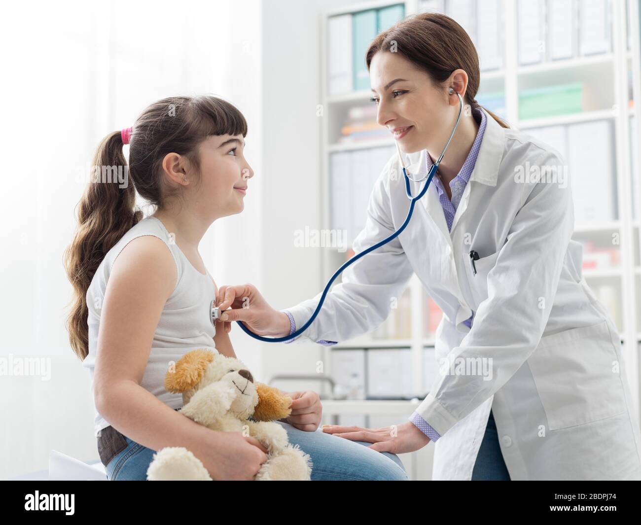 Doctor With Stethoscope With Child