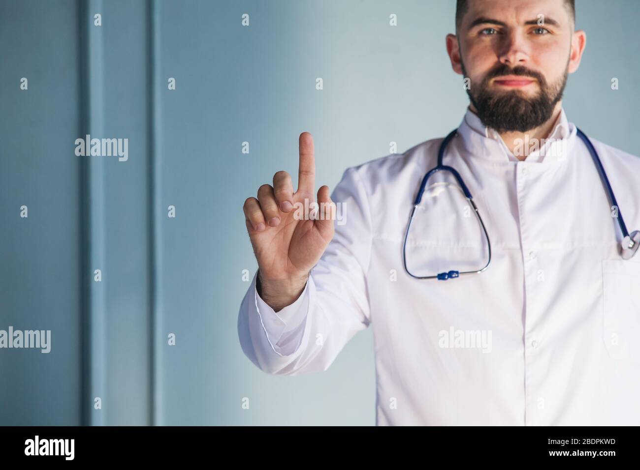 Doctor with stethoscope working with virtual screen Stock Photo - Alamy