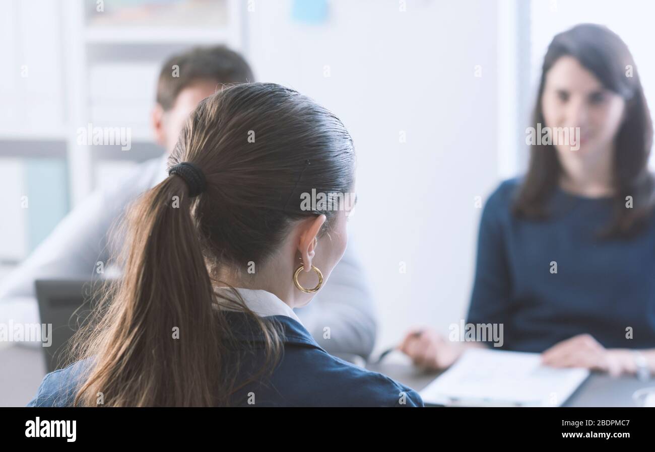 Young female candidate having a job interview in a corporate office ...