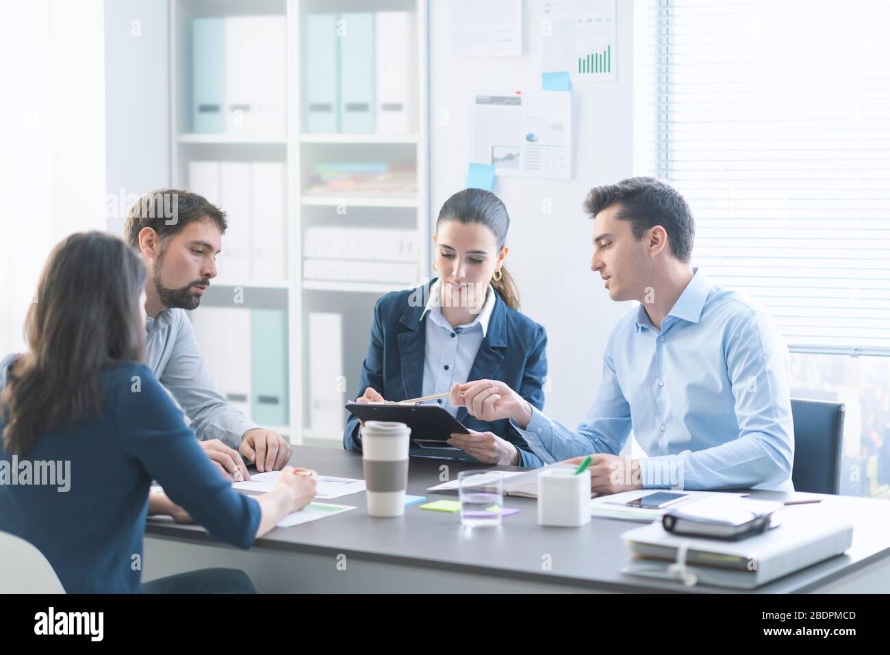Young professional business team working together in the conference ...
