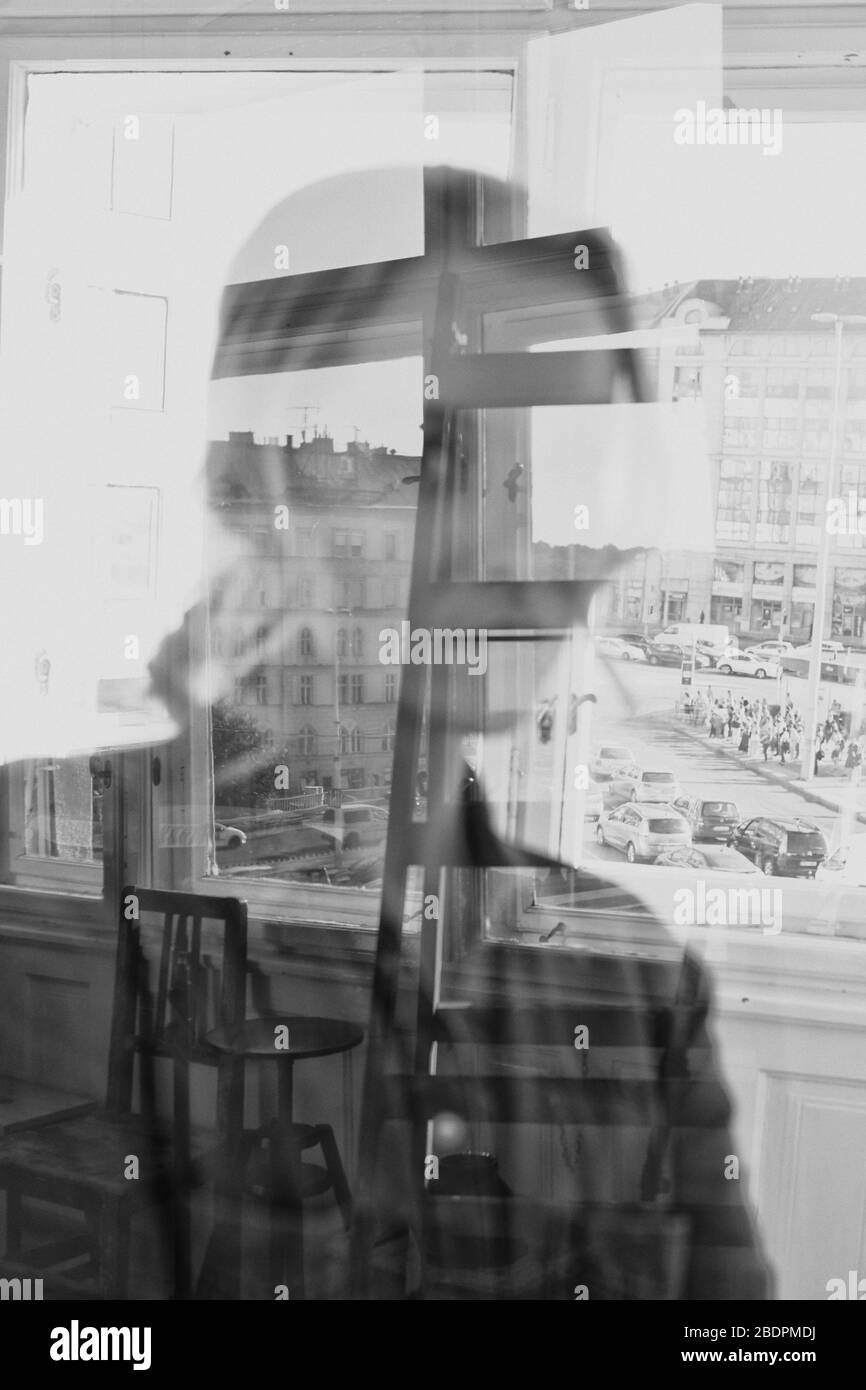 Beautiful blond woman through the window. Art portrait in a photo ...