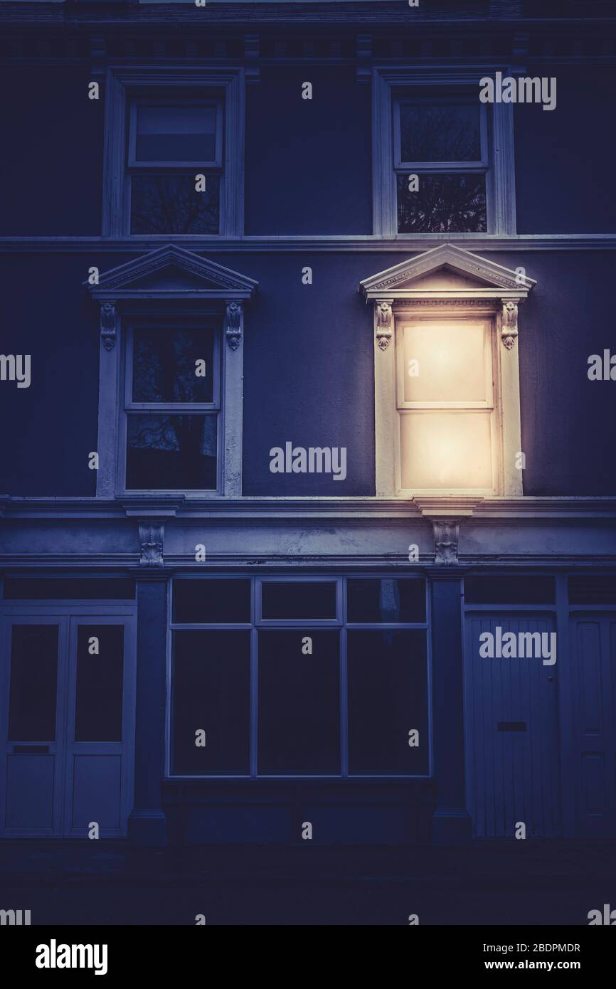 Illuminated window in a house at night Stock Photo - Alamy
