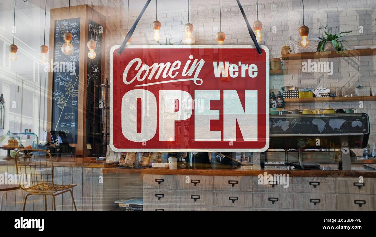 A business sign that says 'Come in We're Open' on Cafe / Restaurant ...