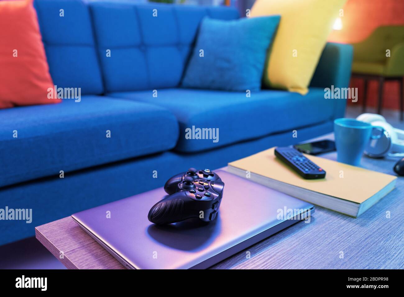 Colorful living room interior with couch, video game controller in the ...