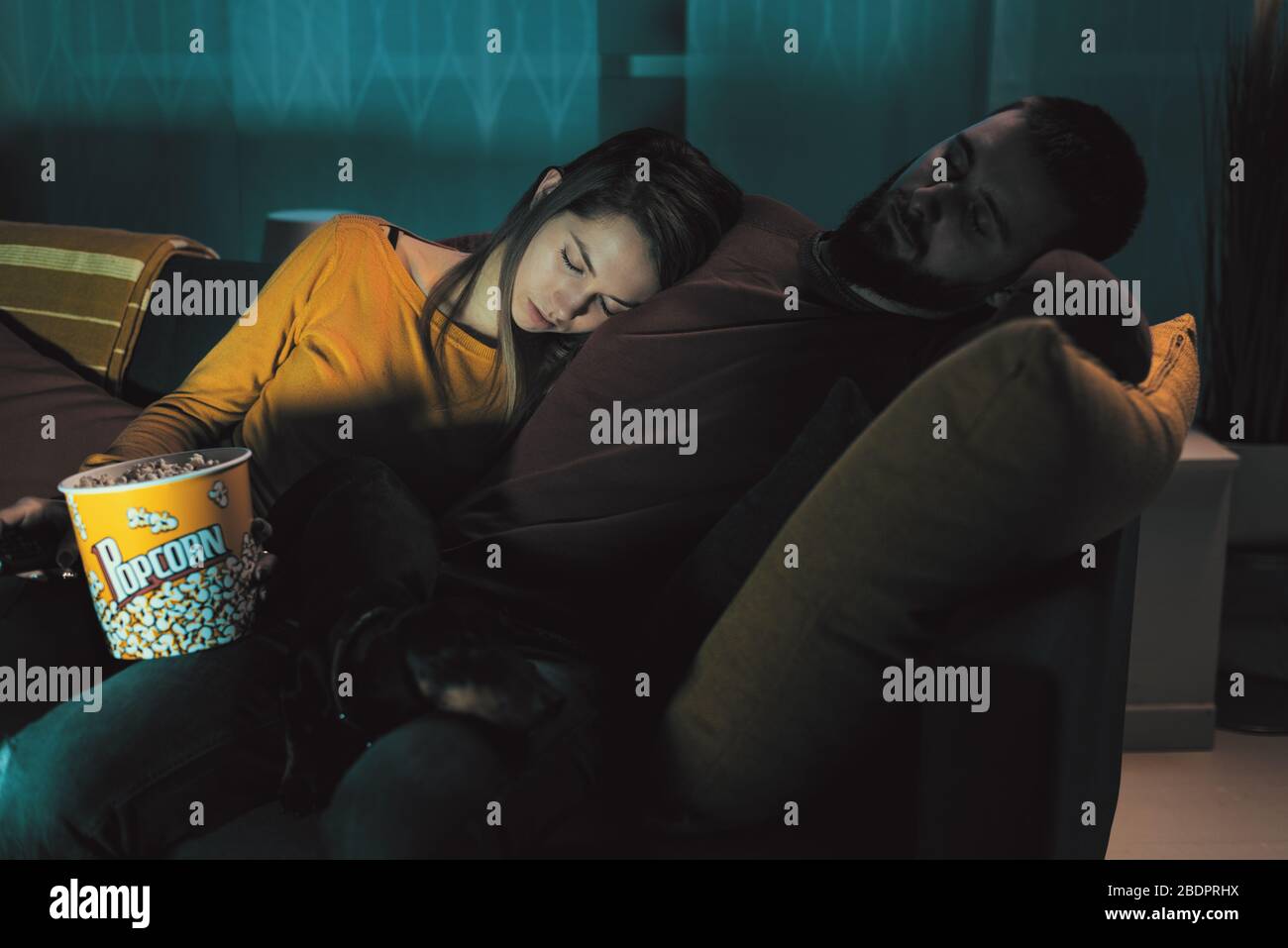 Tired couple watching tv at night hi-res stock photography and images ...
