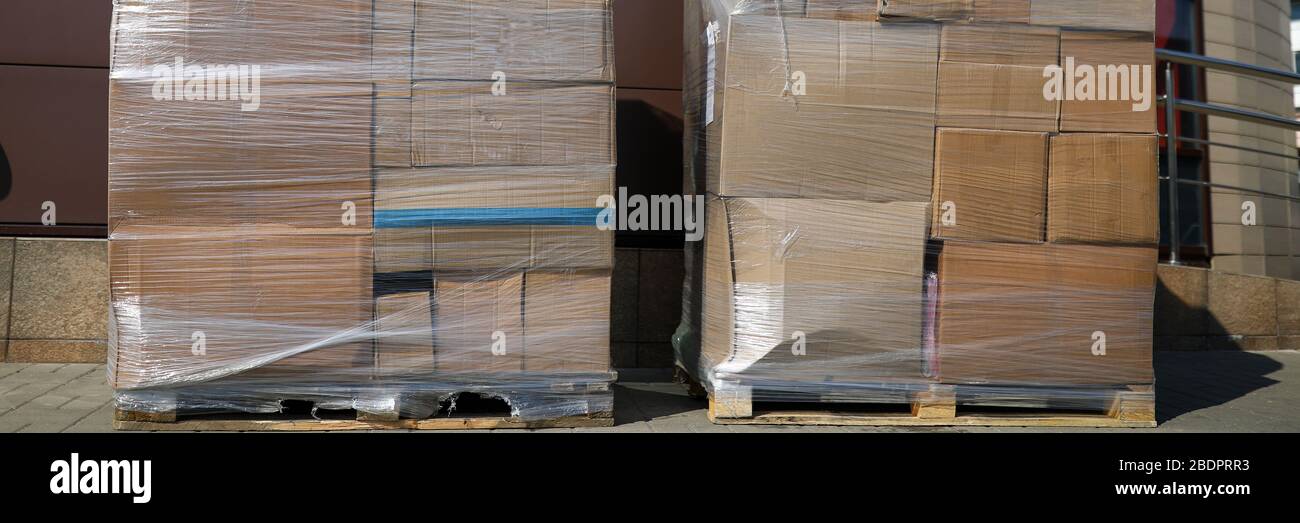 Huge pile of cardboard boxes packed together with stretch tape Stock ...