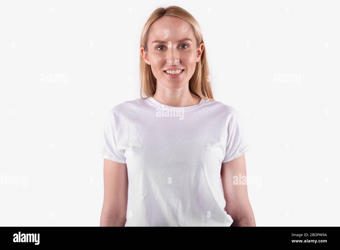 Beautiful young woman looks at camera with smile. Isolaten on white ...