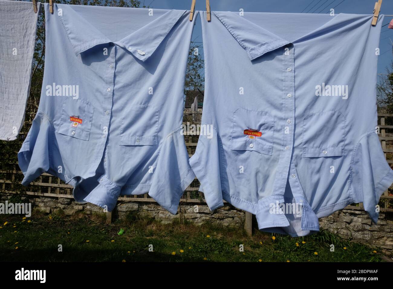 Royal Mail uniform hanging on the washing line Stock Photo - Alamy