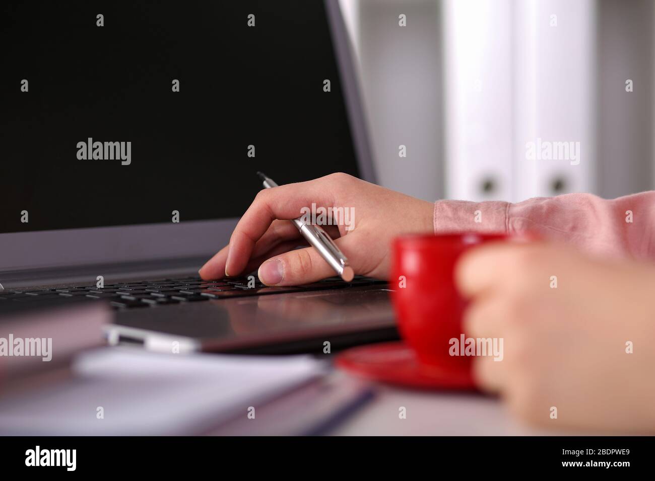 Female hands push buttons on laptop keyboard Stock Photo - Alamy