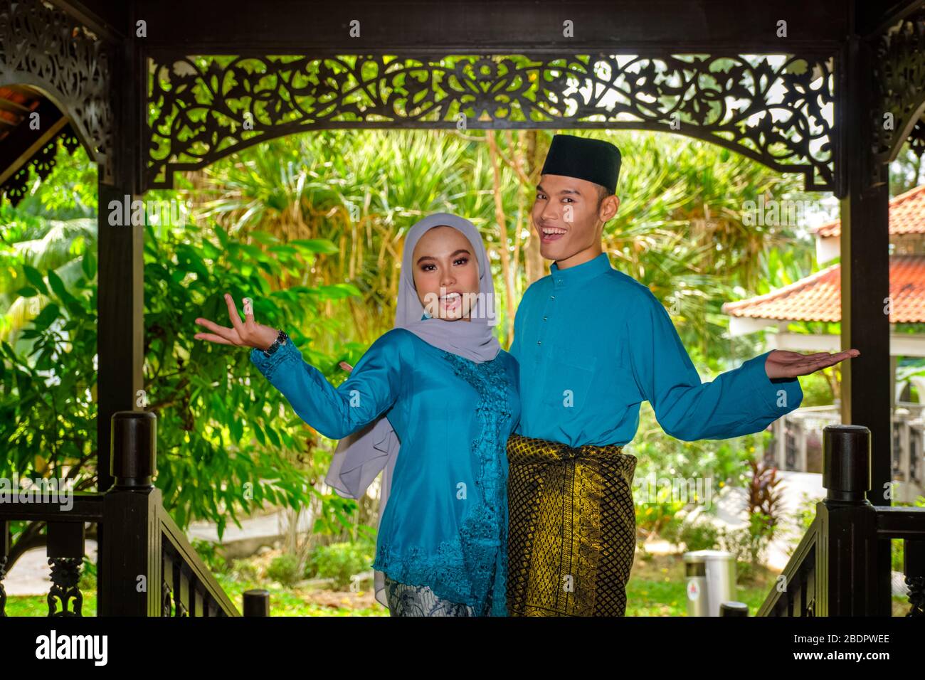 A portrait of young couple of malay muslim in traditional costume ...