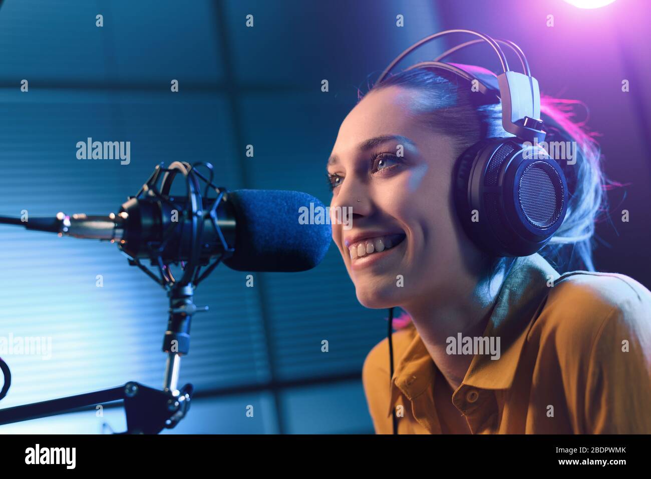 Wearing radio microphone hi-res stock photography and images - Alamy