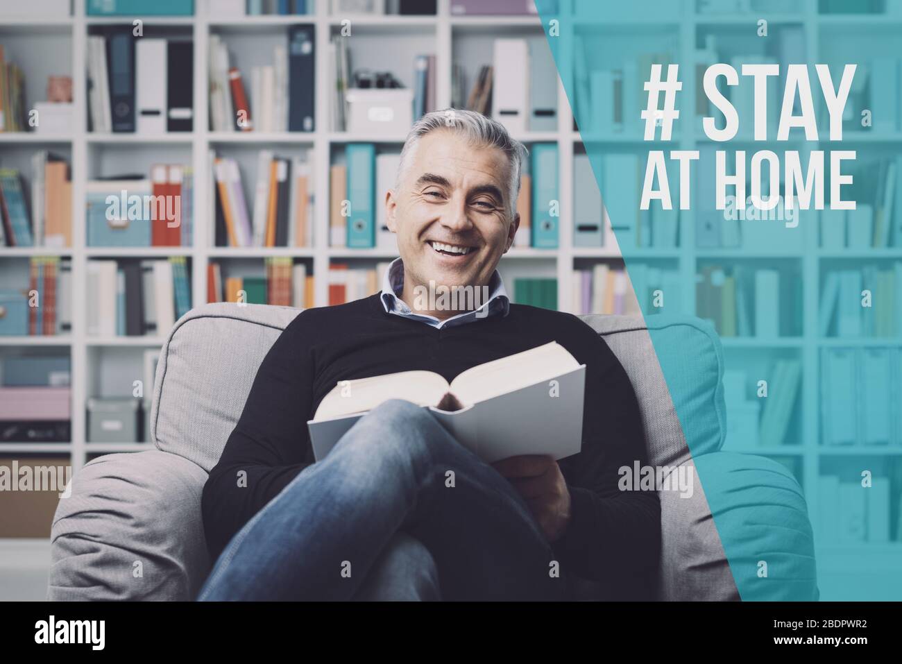 Smiling man reading a book and relaxing at home alone: stay at home ...
