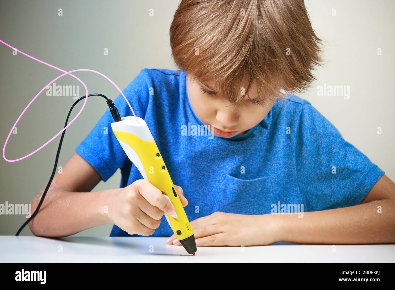 Child using 3D printing pen. Boy making new item. Creative, technology ...