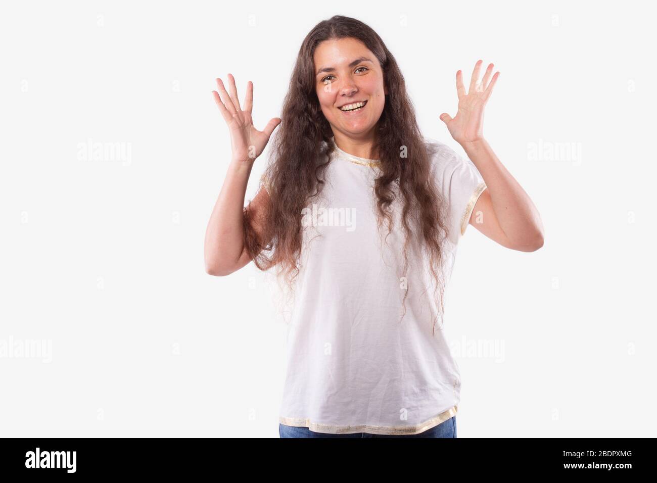 Girl broadly smiles. Hands in surprise pose. Pleasant suddenness ...