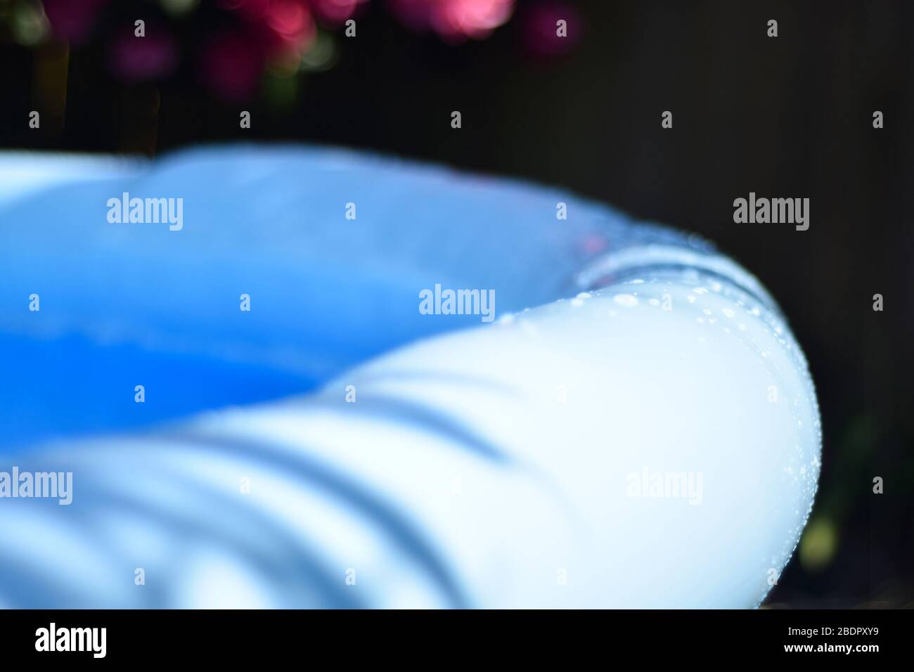 Waterdrops on inflatable swimming pool in garden on a summer day Stock ...