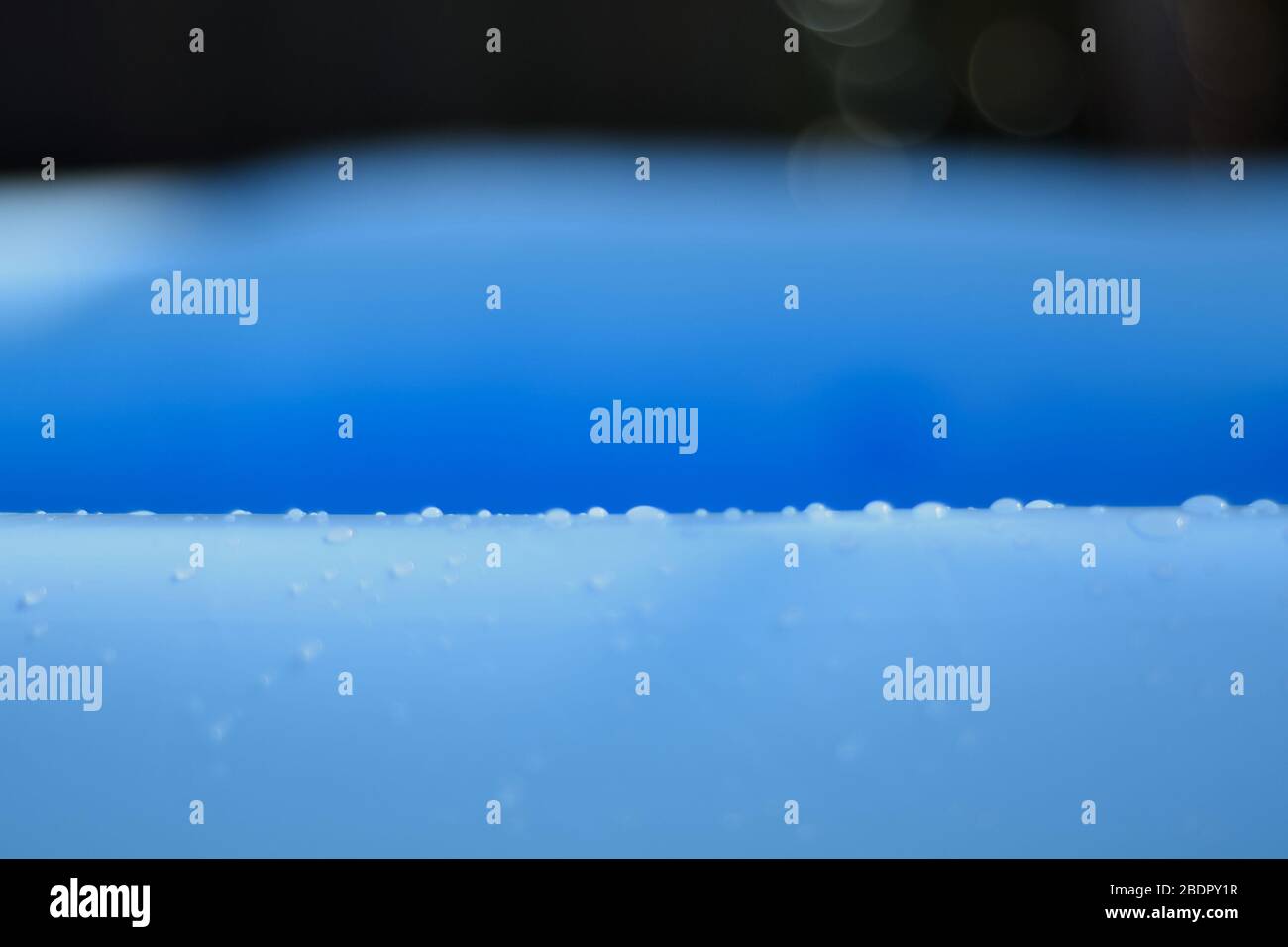 Waterdrops on inflatable swimming pool in garden on a summer day Stock ...
