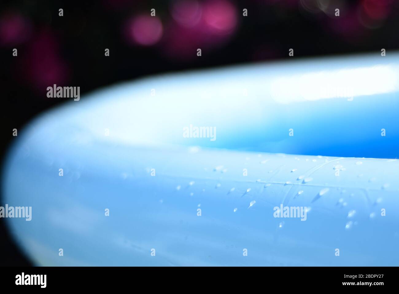 Waterdrops on inflatable swimming pool in garden on a summer day Stock ...