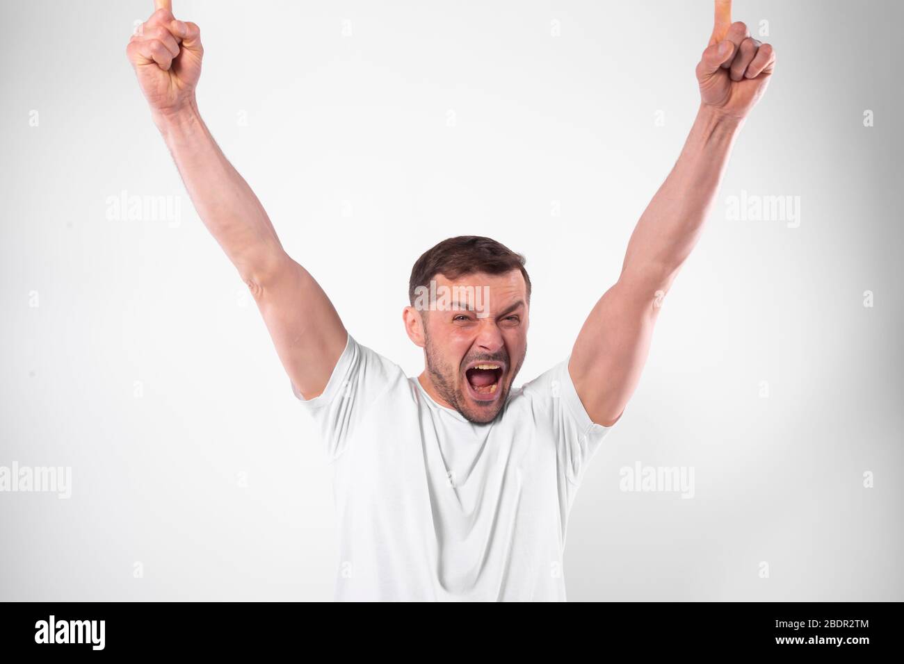 Man screaming with joy. Hands over head. Happiness of victory and win ...