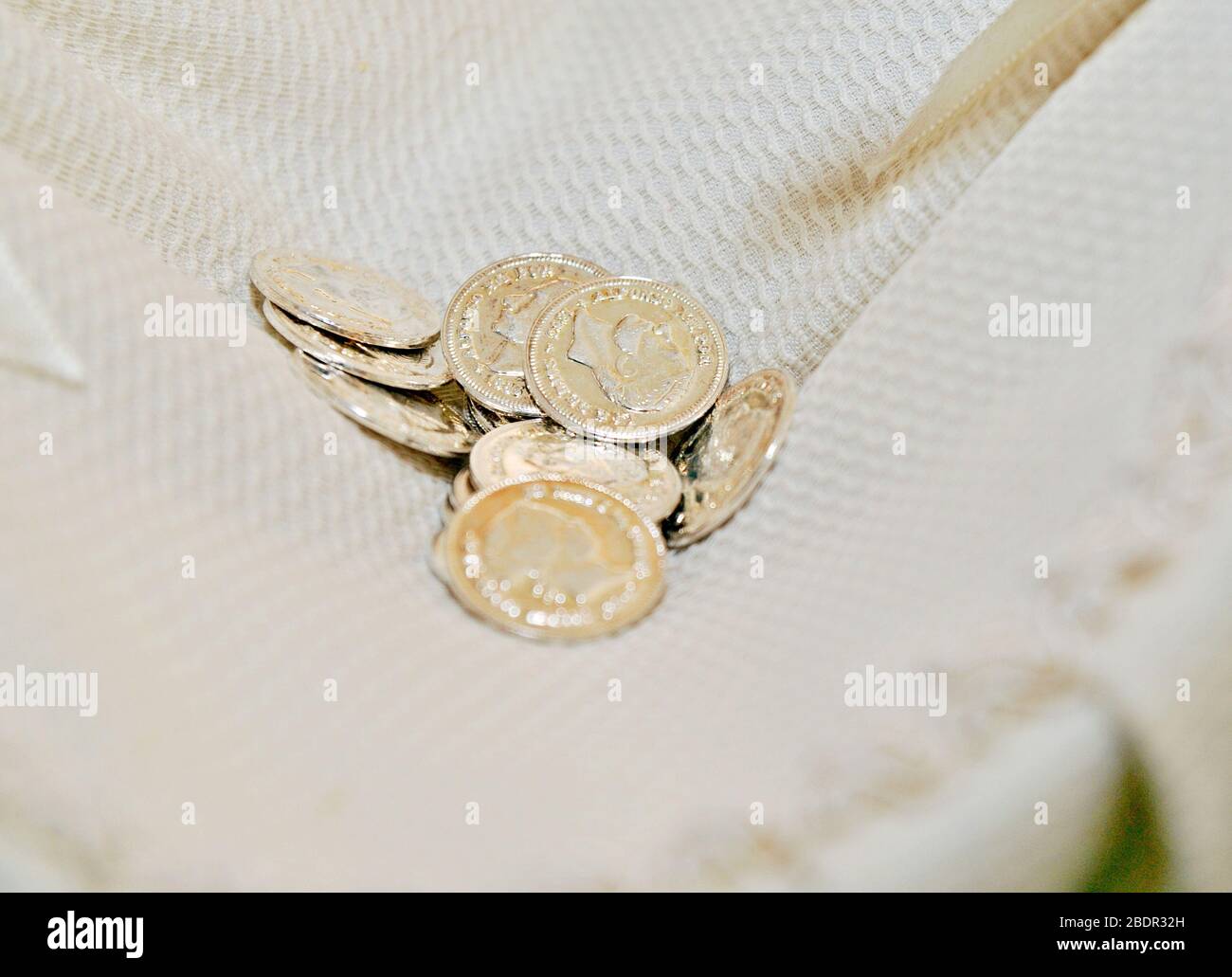 Arras,silver coins close up view for a wedding Stock Photo - Alamy
