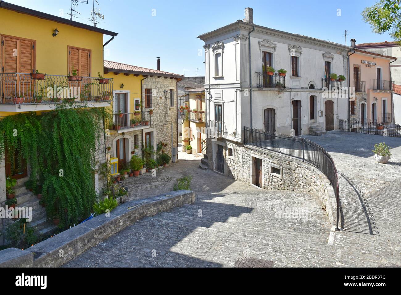 A narrow street between the houses of Pietrelcina, a town in the ...