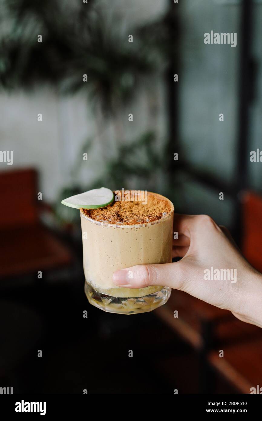 Beautiful hand serve coffee in beautiful glass with decoration in ...