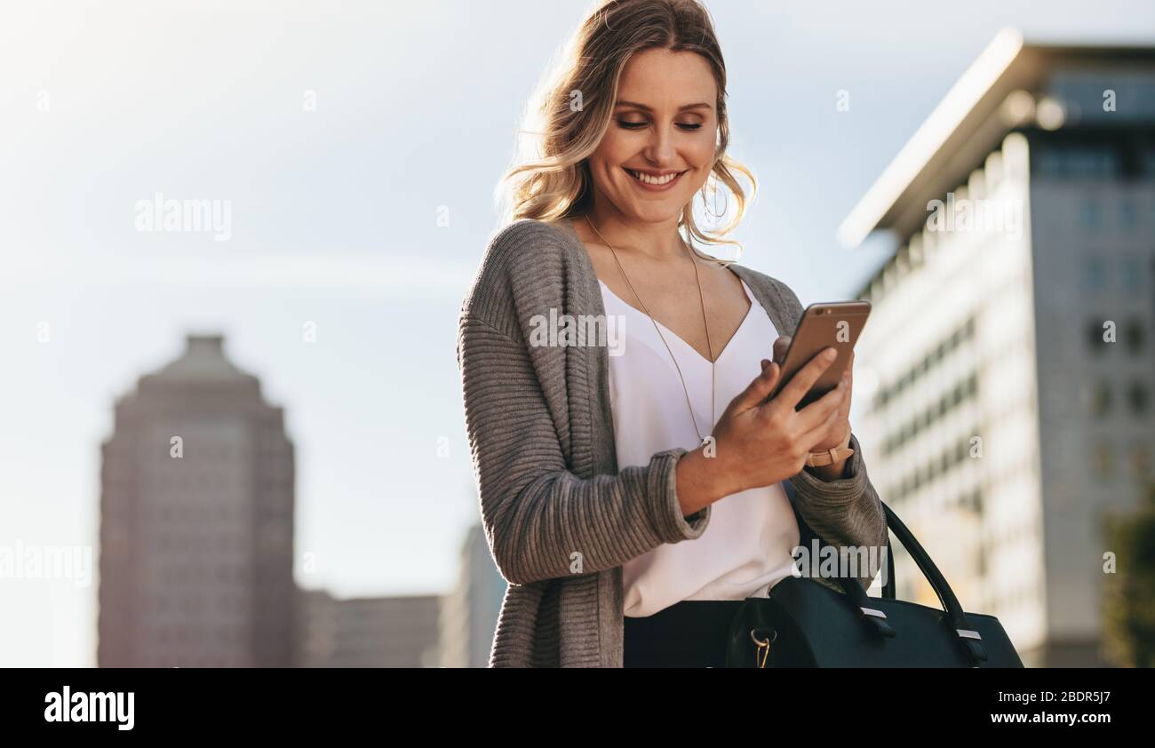 Young woman on phone commuter hi-res stock photography and images - Alamy