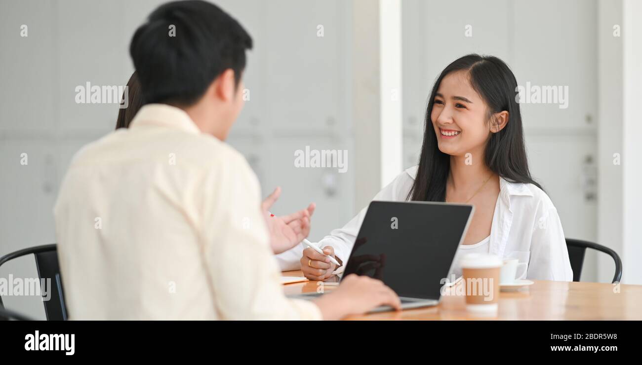 Business developer group talking/meeting/discussing together while ...