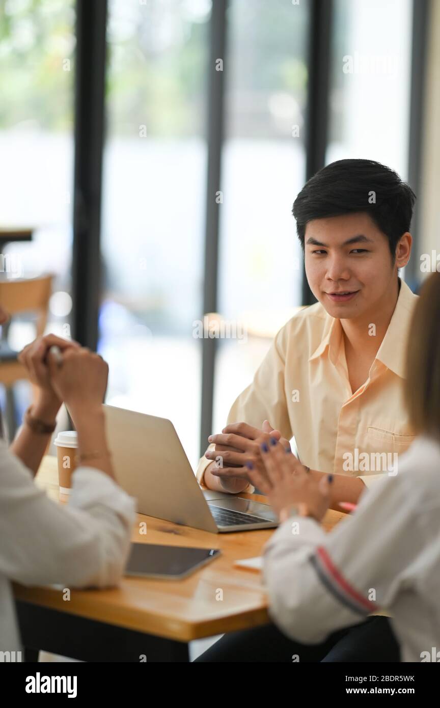 Photo of business developer group talking/meeting/discussing together ...