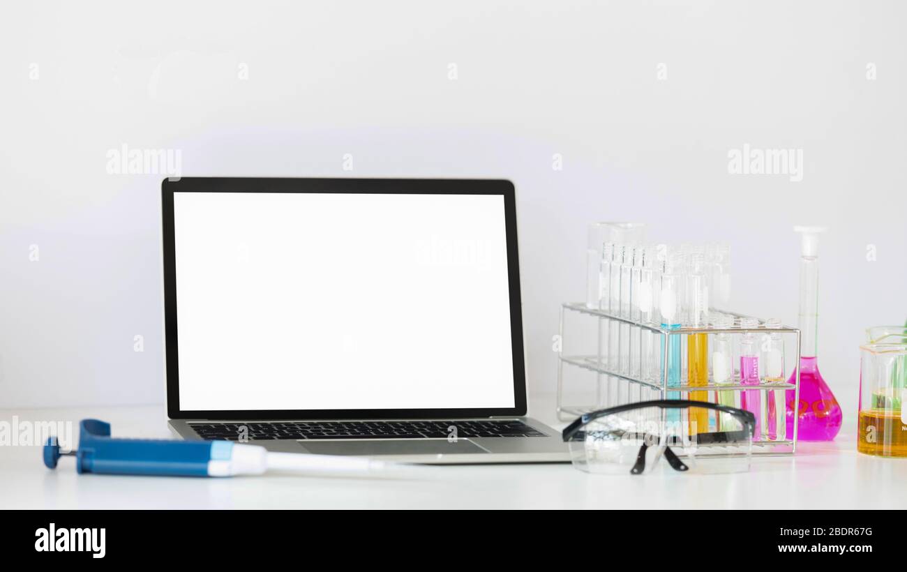 Photo of Scientific experiments equipment putting on white working desk ...