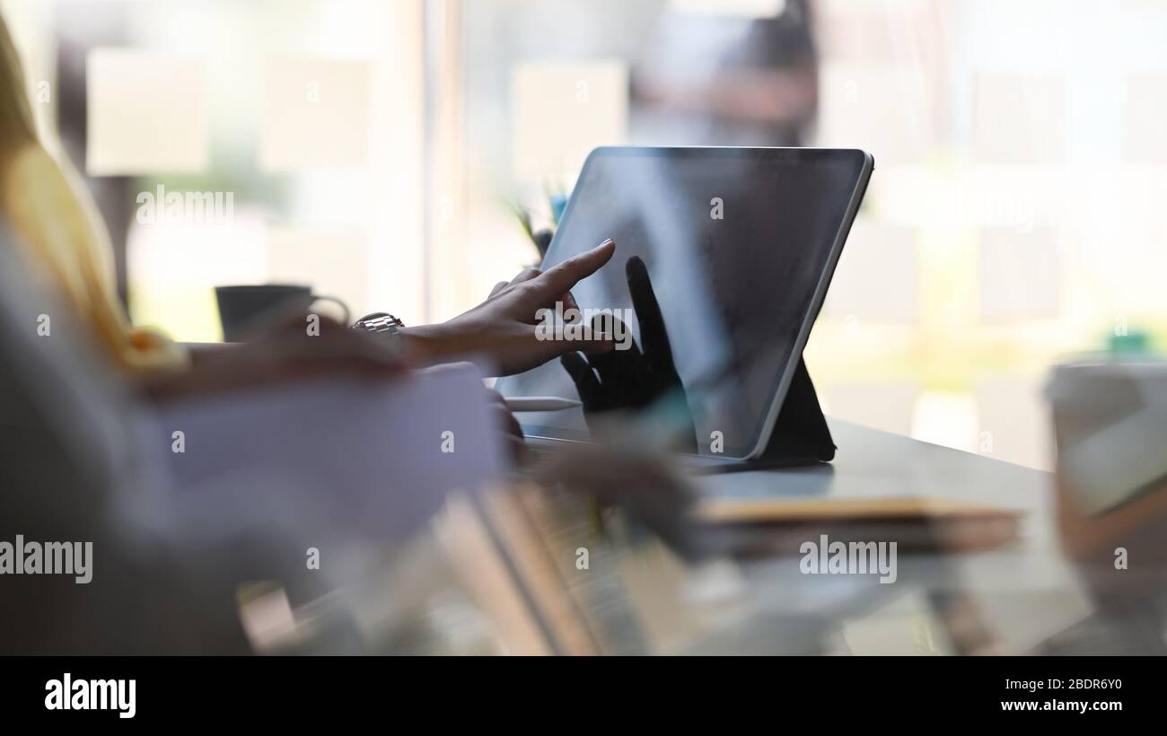 Cropped image of Designer woman's hand using a stylus pen to drawing on ...