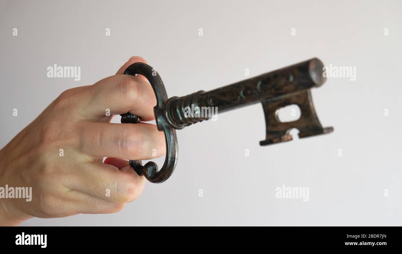 Corkscrew for opening bottles in the form of a key in a woman's right ...