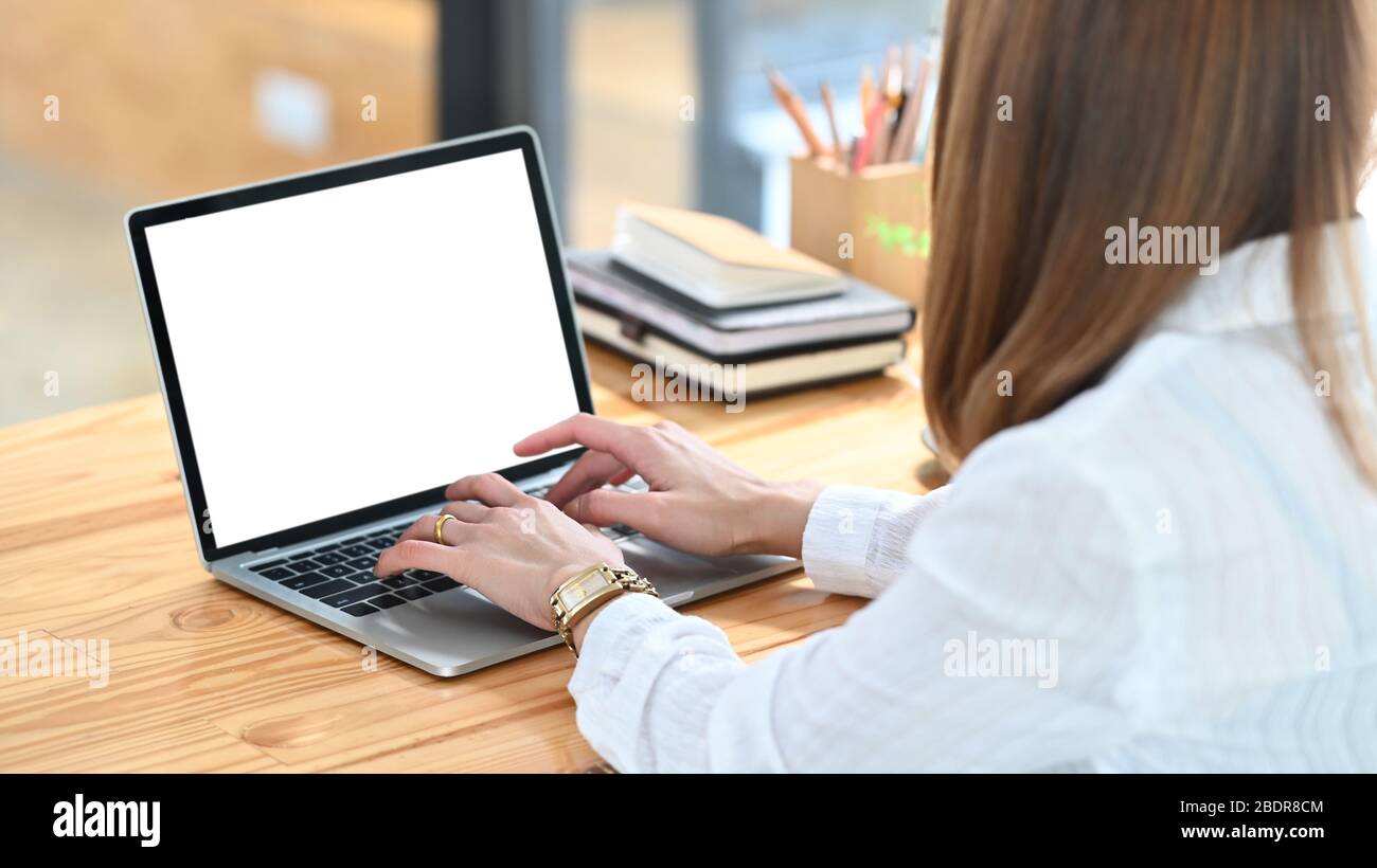 Cropped image of beautiful woman working as secretary typing on ...