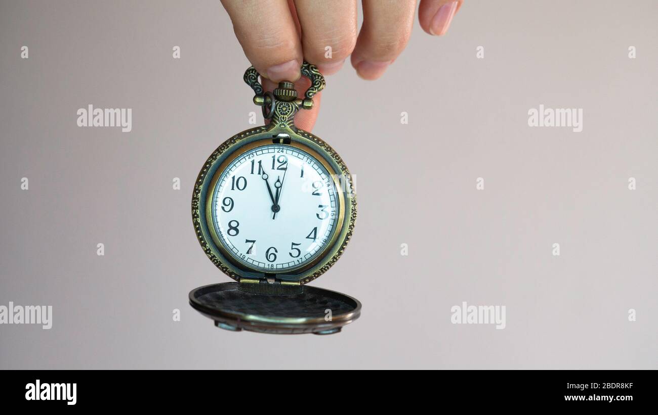 Tick tock the clock is ticking 5 minutes to 12 o'clock Stock Photo - Alamy