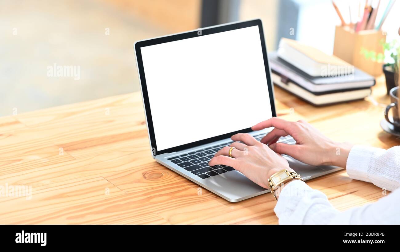 Cropped image of secretary hands while typing on computer laptop with ...