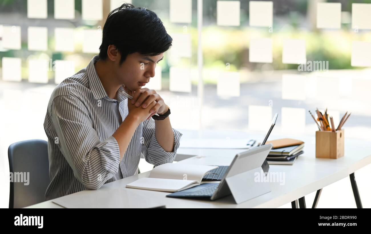 Smart man working as Project administrator giving a concentrated on ...