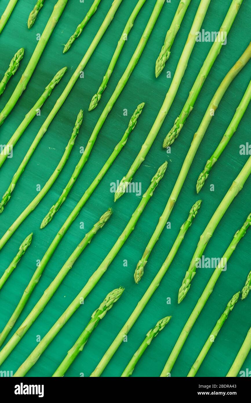 Fresh green asparagus pattern, top view. Food background asparagus flat ...