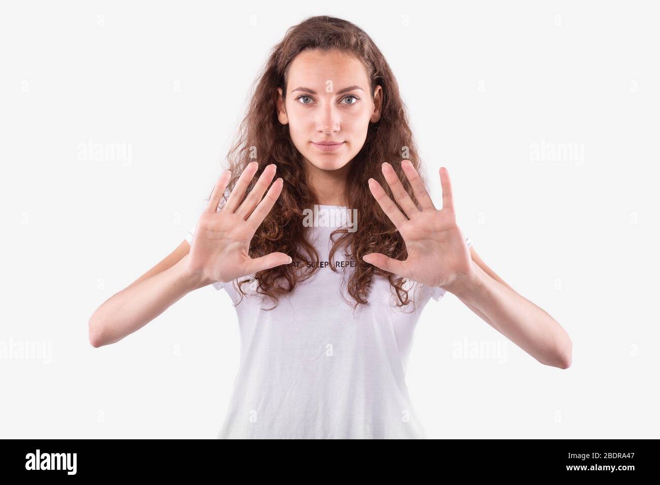 Caucasian girl showing her opened palms. Isolated on white background ...