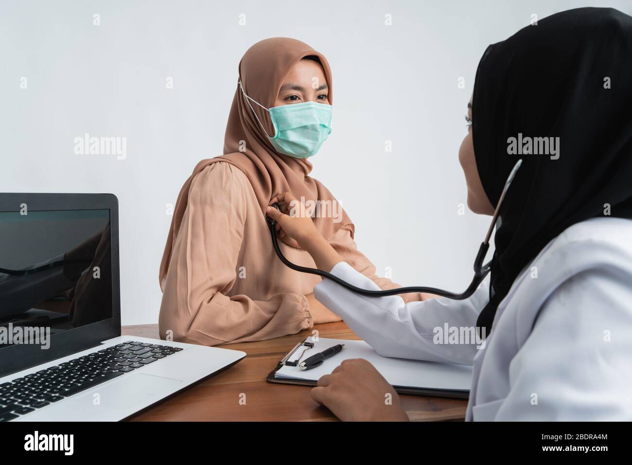 muslim patient during medical check up with doctor wearing masks Stock ...