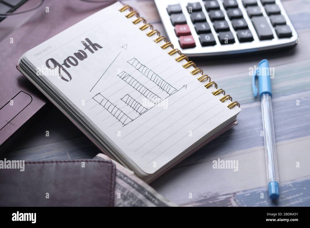 growth chart on notepad on office table Stock Photo - Alamy