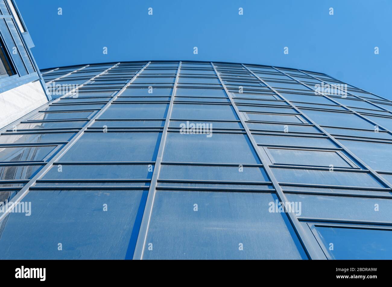 Modern office building in blue glass Stock Photo - Alamy